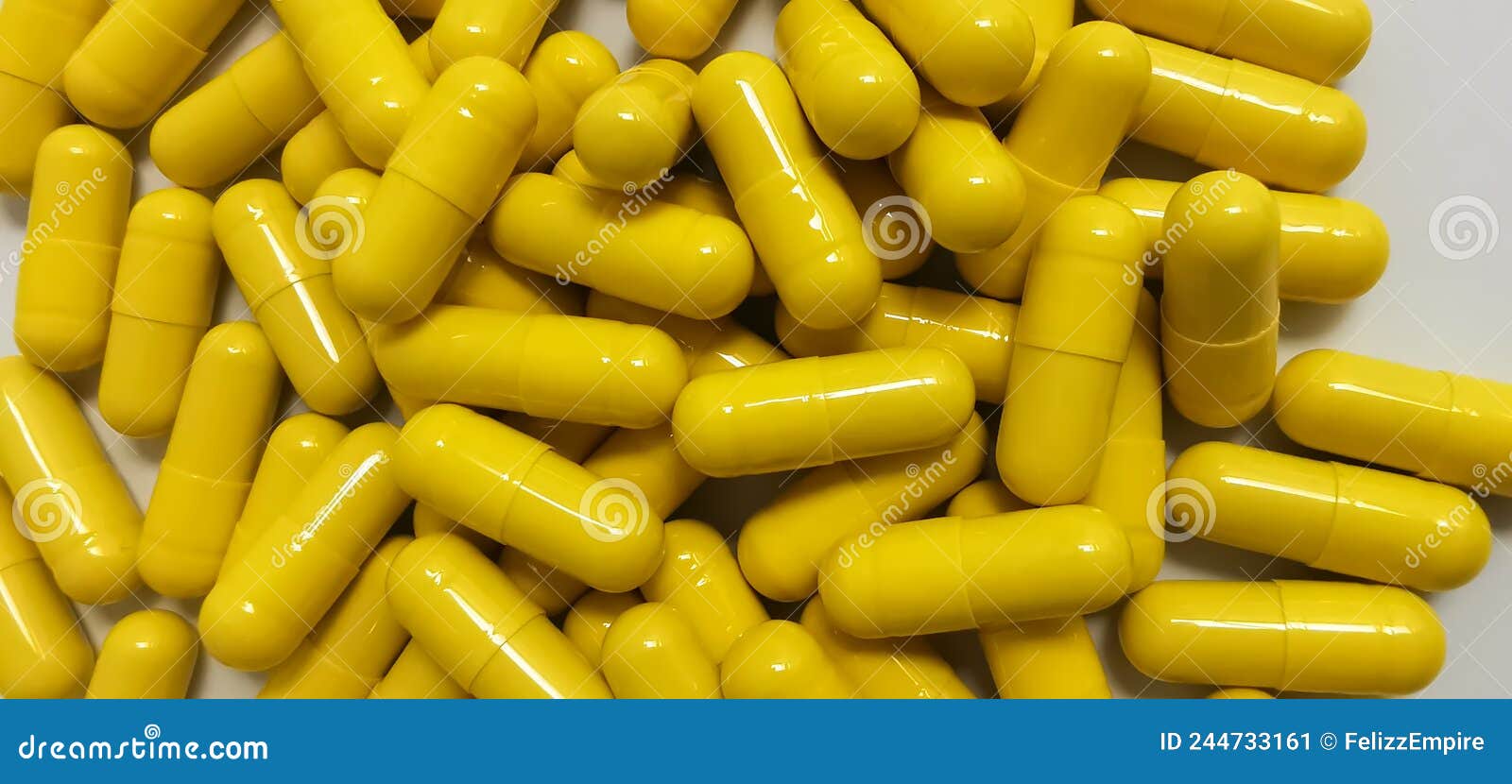 Yellow Capsules on White Background. Selective Focus. Stock Image ...