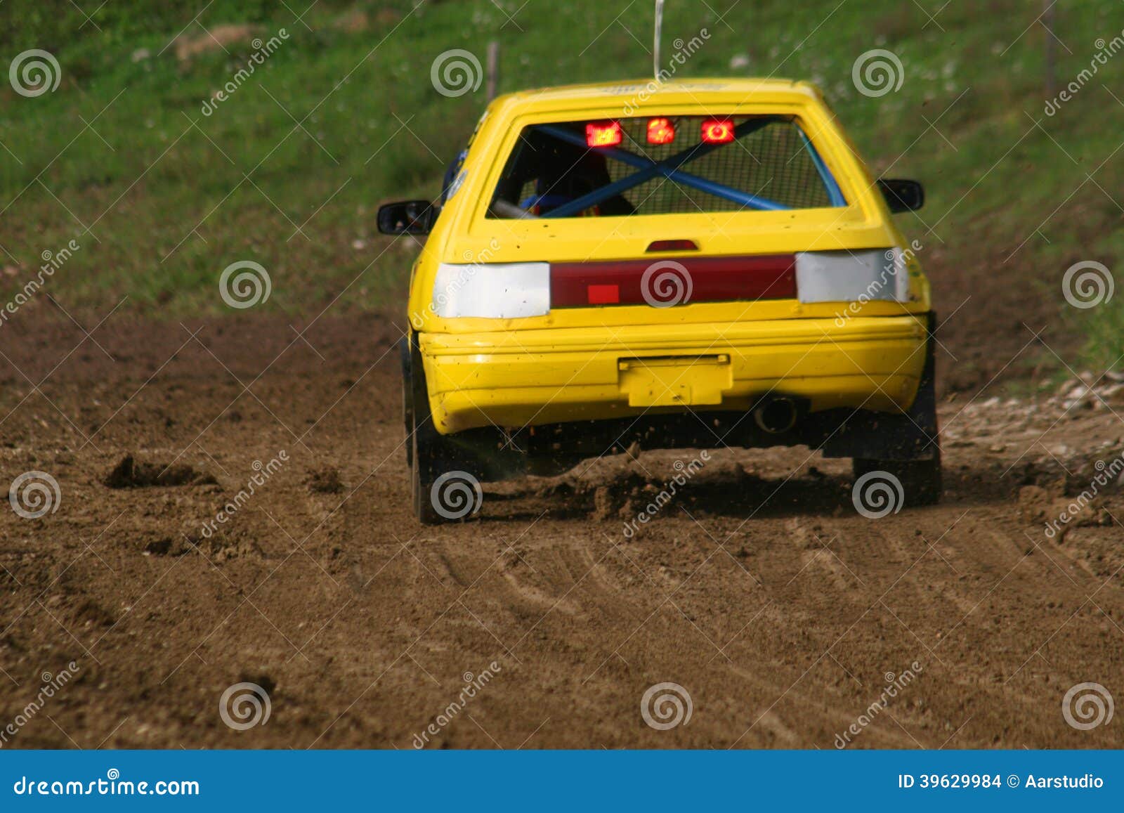 Yellow Car on Track Going Fast and Throwing Dirt in the Air Stock Photo ...