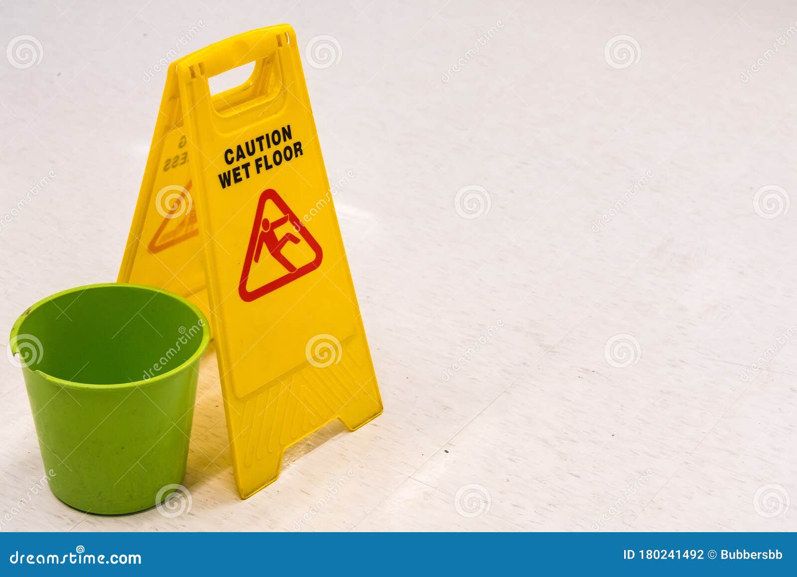 Yellow Caution Wet Floor Sign on Broken Mall Floor Tiles Stock Photo ...