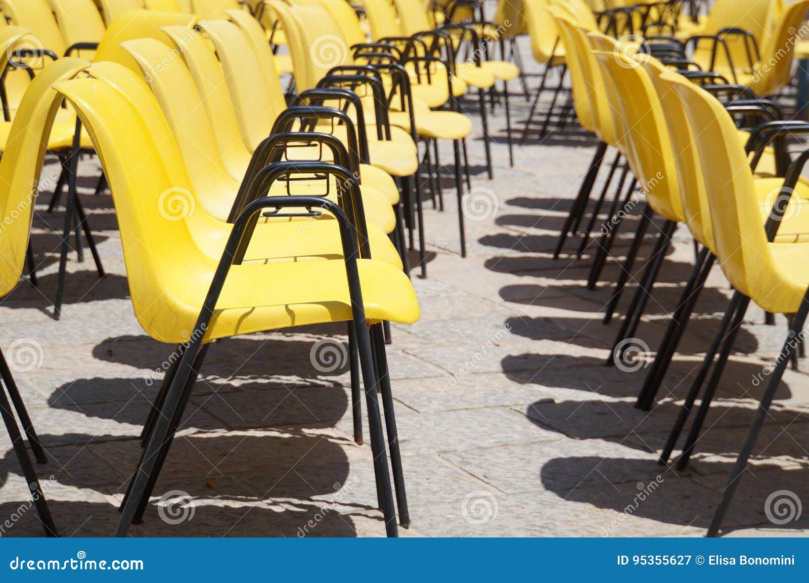Yellow chairs parade stock image. Image of group, chairs - 95355627