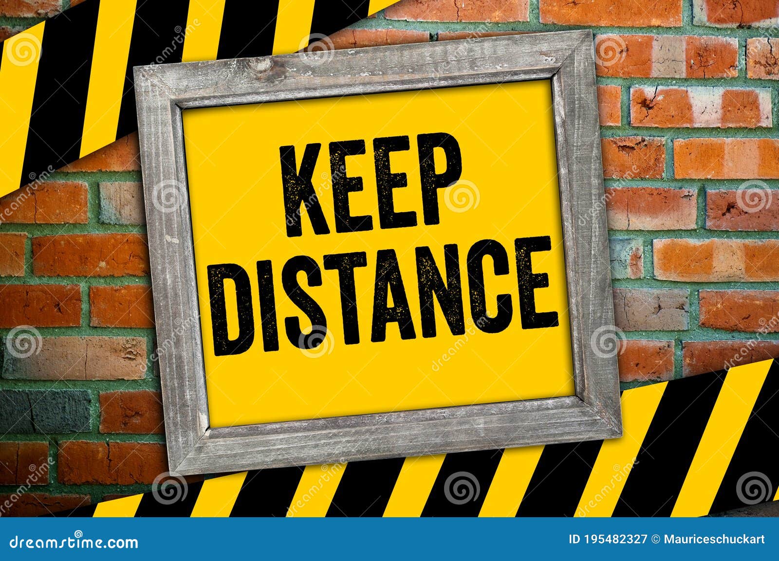 Yellow Chalkboard in Front of a Clinker Wall with Message Keep Distance ...