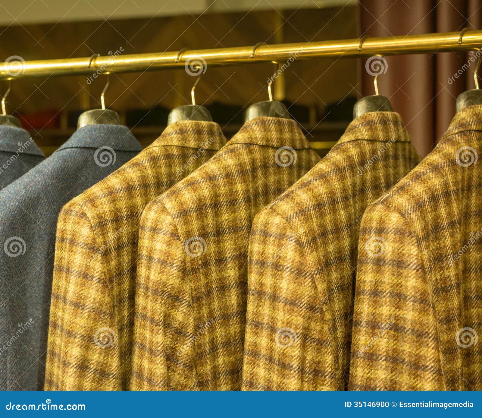 Yellow Checkered Suits on Rack Stock Photo - Image of fabric, jacket ...