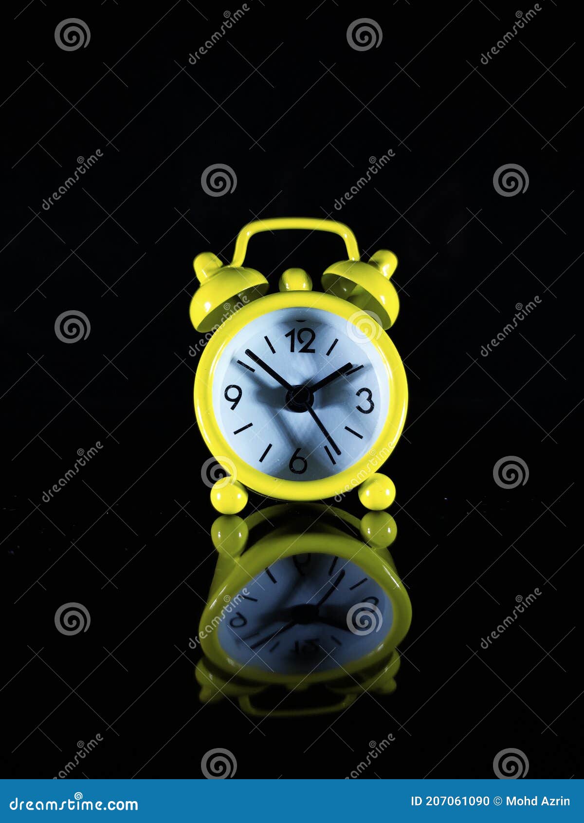 A Yellow Clock with Reflection on a Black Background. Stock ...