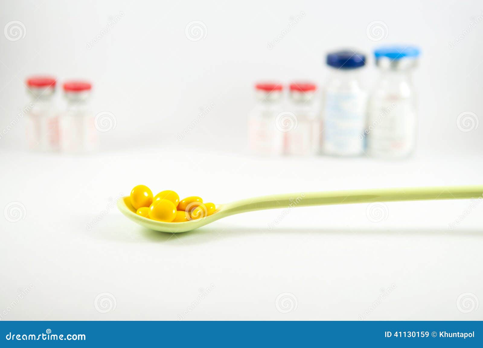 Yellow Coating Tablet In Spoon On Vial Background Royalty-Free Stock ...