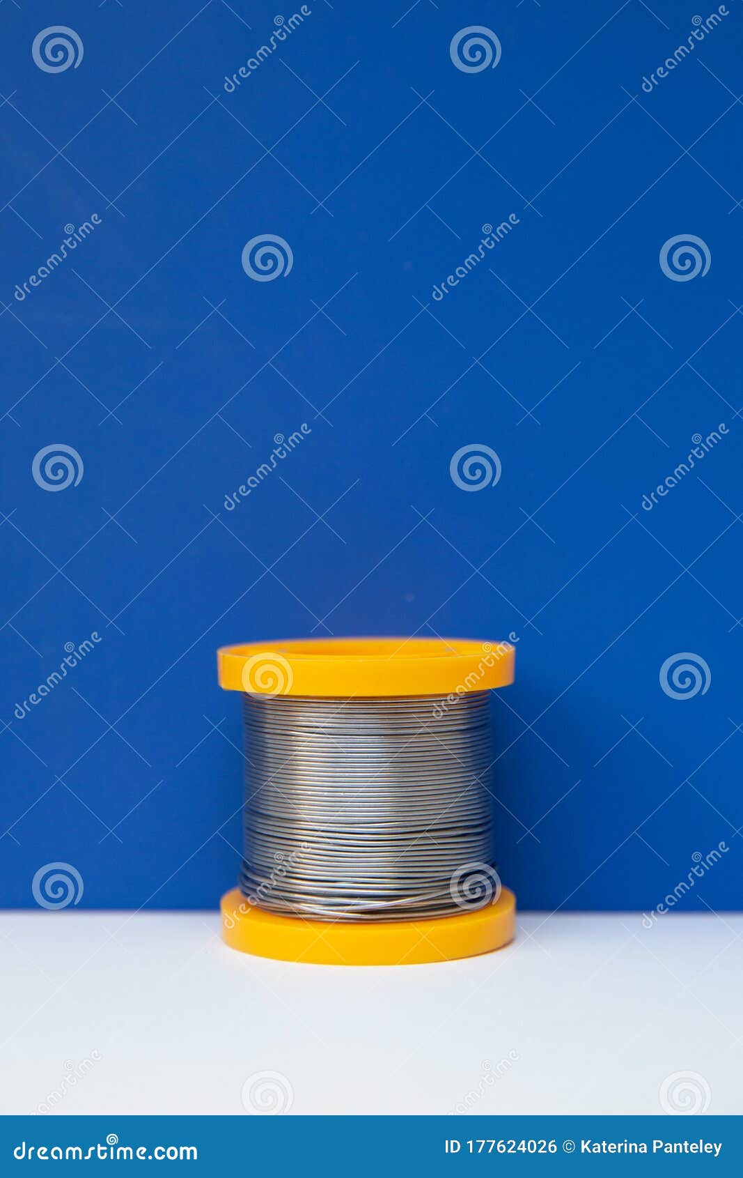 A Yellow Coil of Solder Stands in the Frame. the Coil Stands on the ...