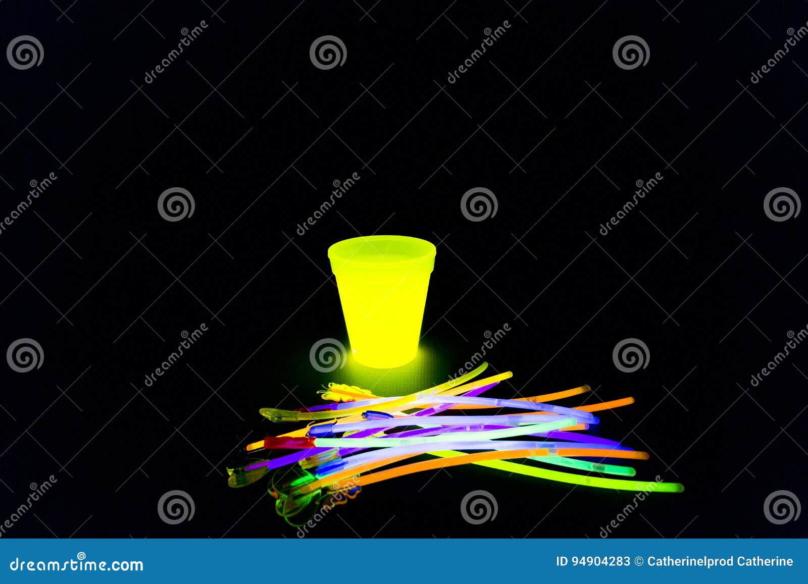 Yellow Colored Fluorescent Glass with Glow Sticks Lights Stock Image ...
