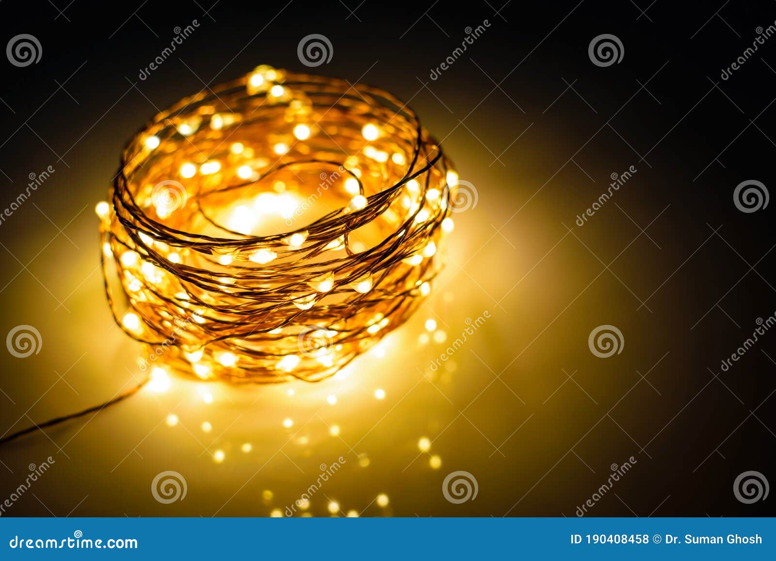 Yellow Colored Light Chain for Decoration Placed on a Reflective ...