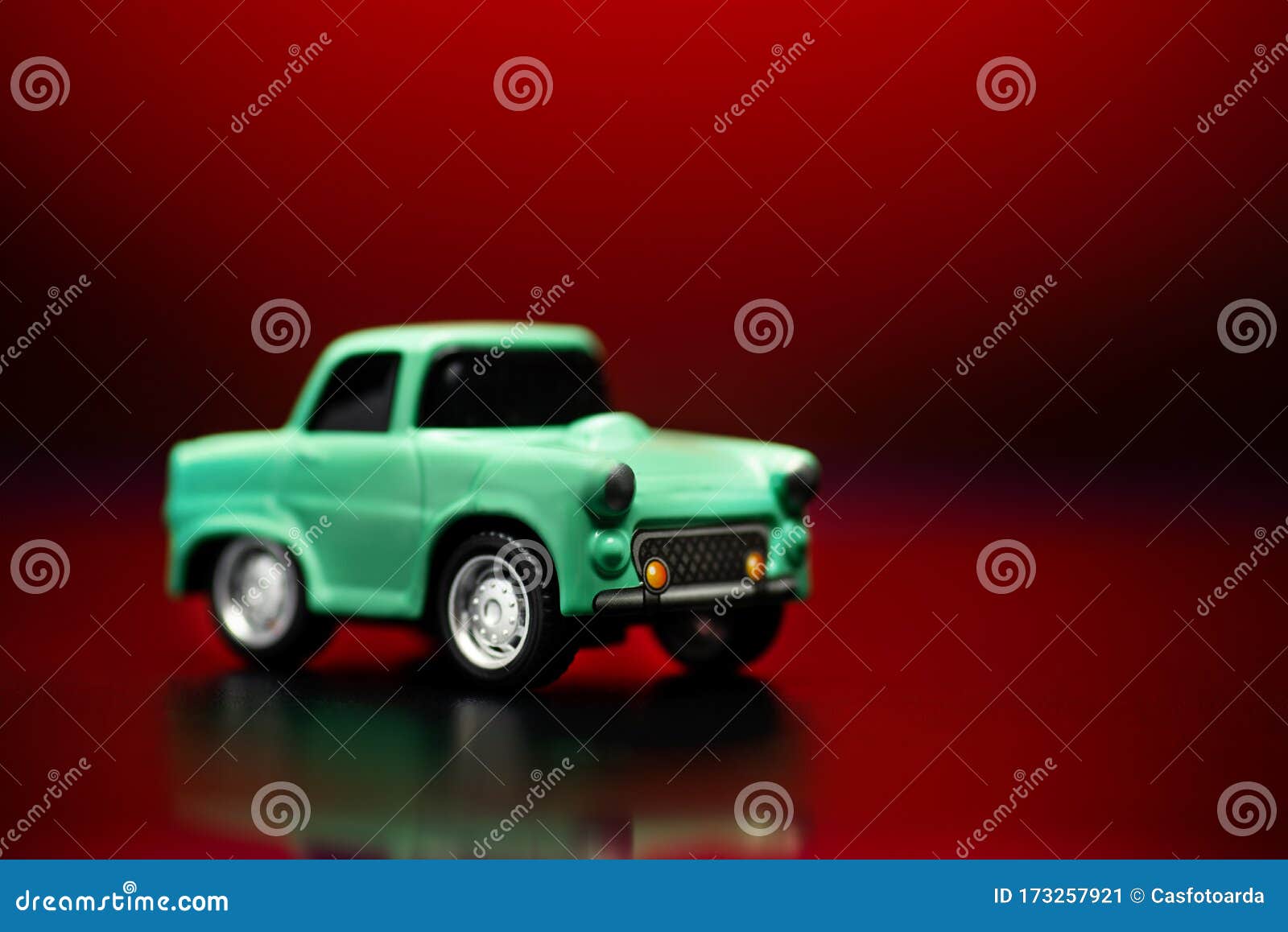 Yellow Colored Toy Model Car on a Red Background Stock Image - Image of ...