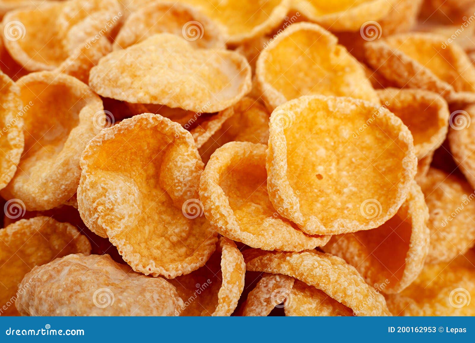 Yellow cornflakes closeup stock image. Image of grain - 200162953