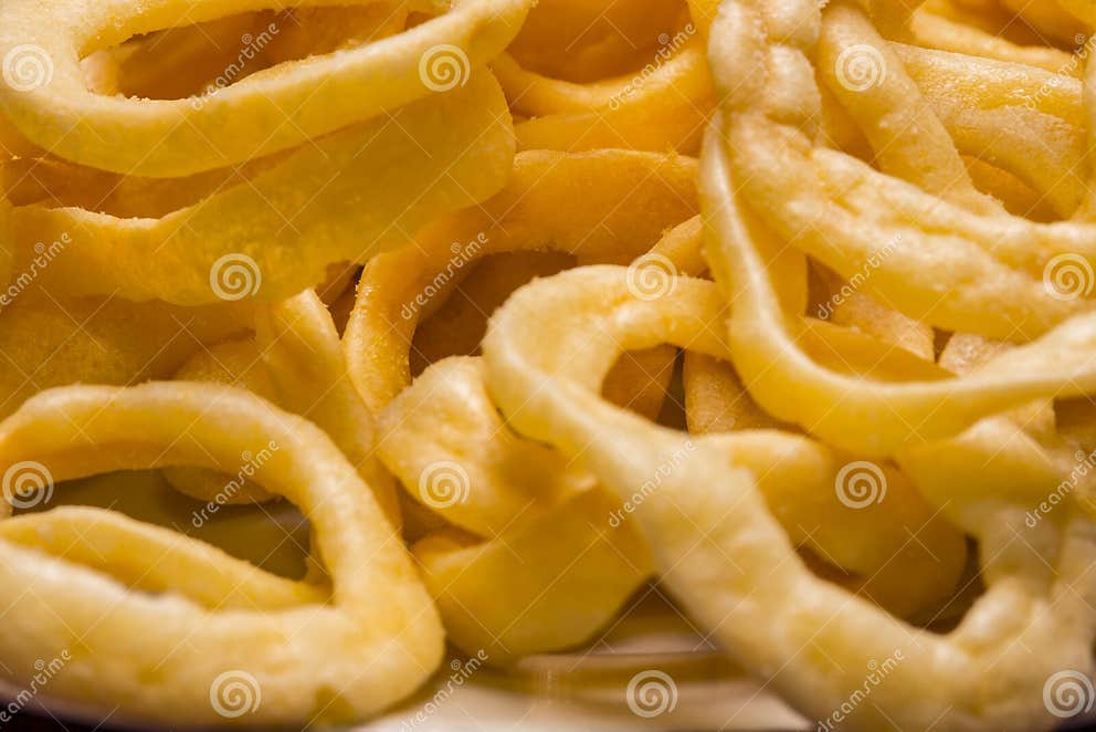 Yellow crisps rings macro stock photo. Image of macro - 38282152