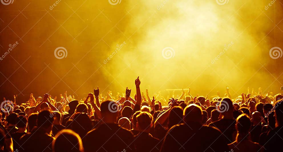 Yellow crowd at concert stock image. Image of arms, encore - 5505809
