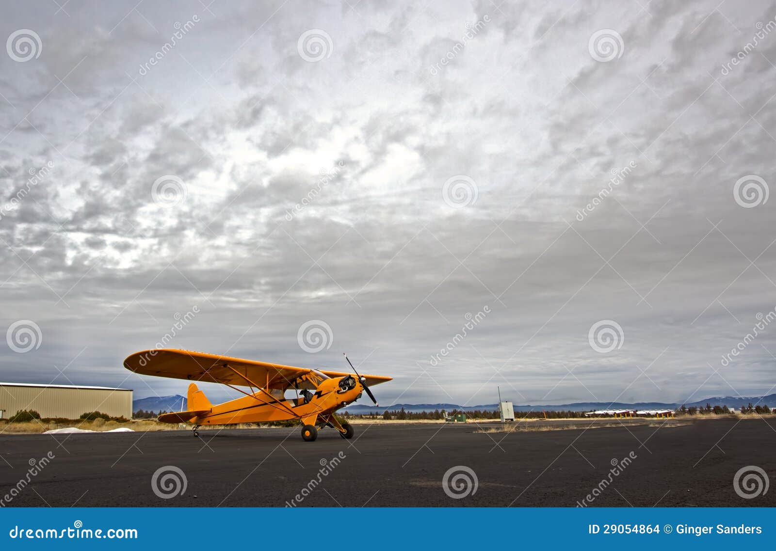 Yellow Cub Airplane with Dramatic Sky Stock Photo - Image of gray ...