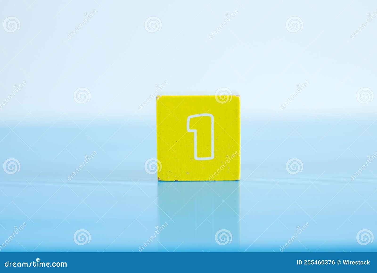 Yellow Cube with the Number 1 on it Isolated on a Blue Gradient ...