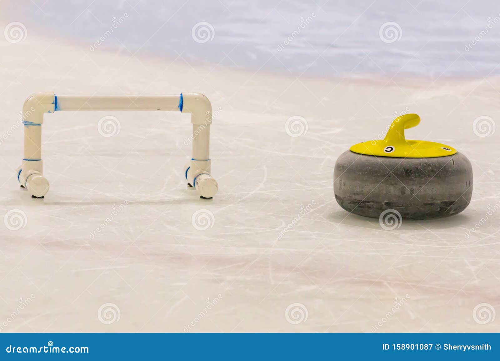Yellow Curling Stone with Stabilizer Bar Stock Image - Image of curl ...