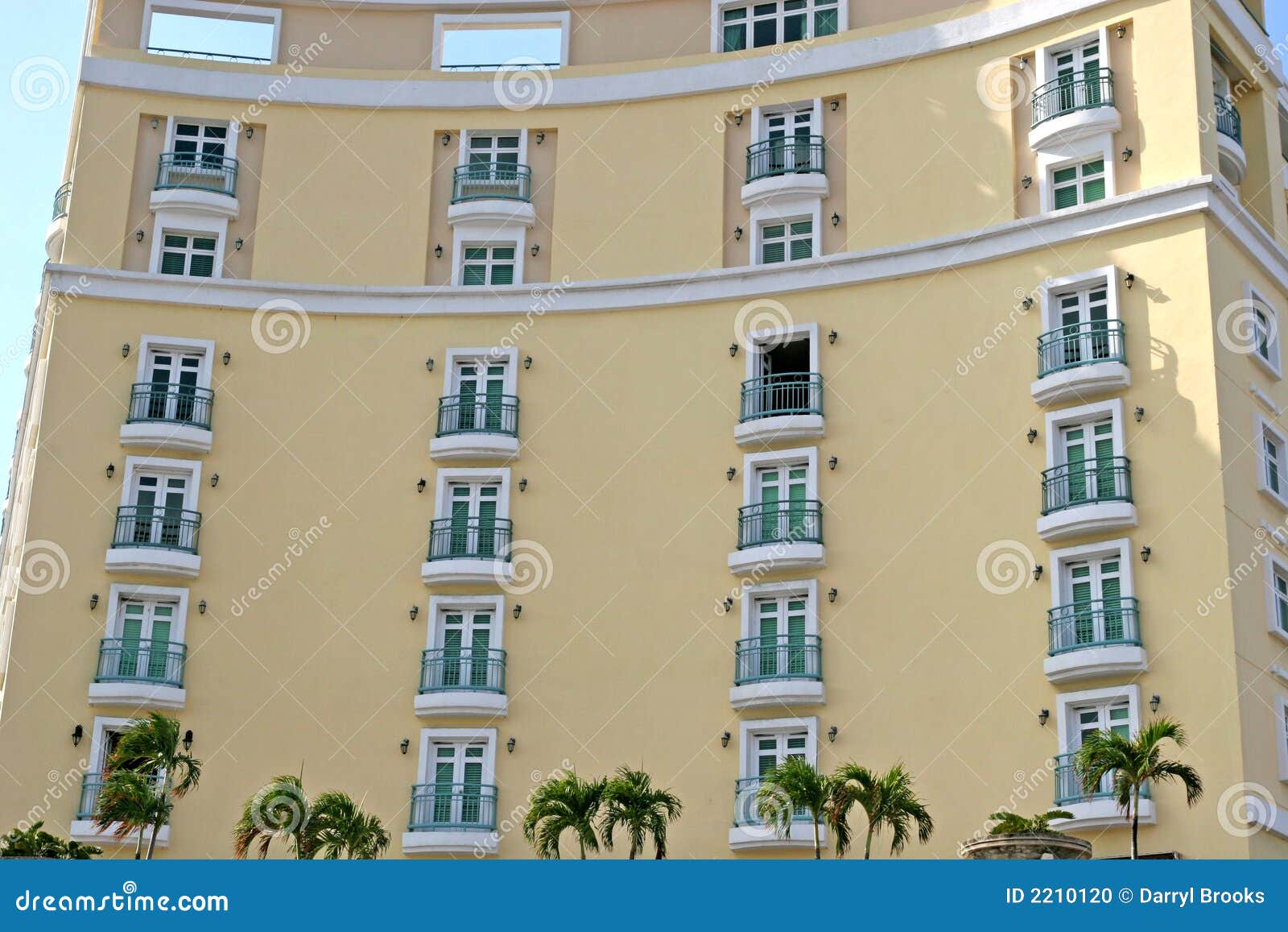Yellow Curved Hotel stock photo. Image of holiday, blue - 2210120