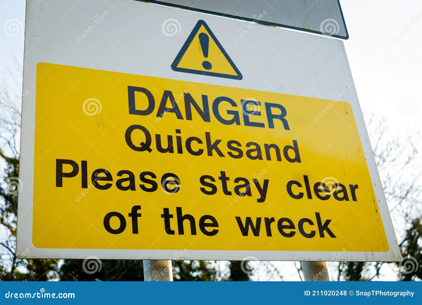 Yellow Danger Quicksand, Please Say Clear of the Wreck Sign on a Tree ...