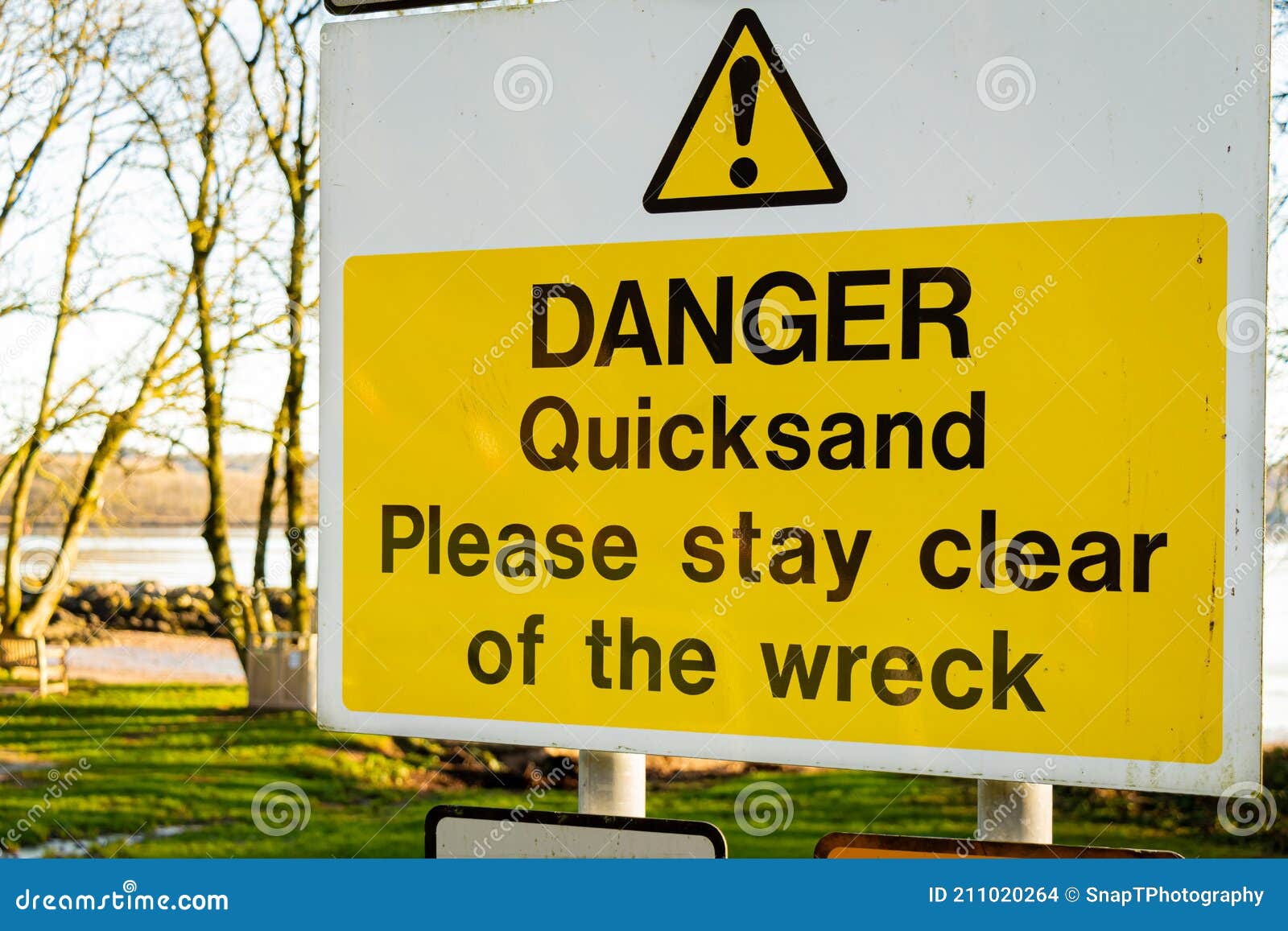 Yellow Danger Quicksand, Please Say Clear of the Wreck Sign on a Tree ...