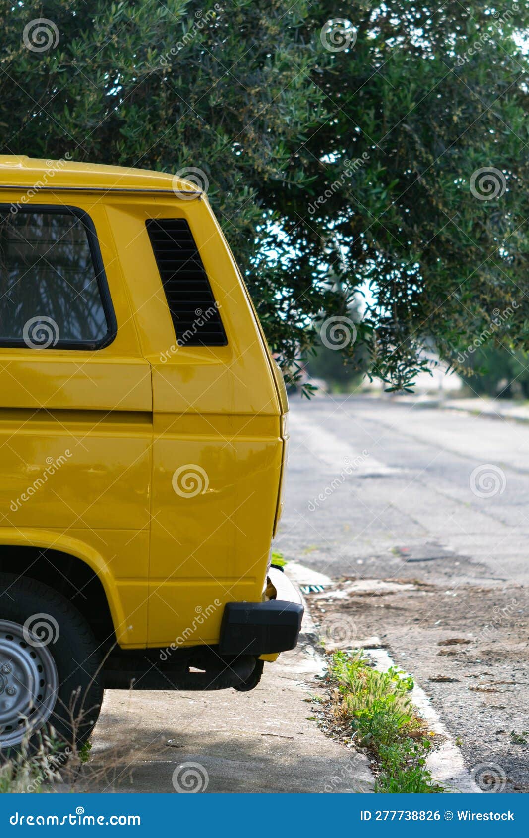 Yellow Delivery Van Parked on the Side of a Street. Stock Photo - Image ...