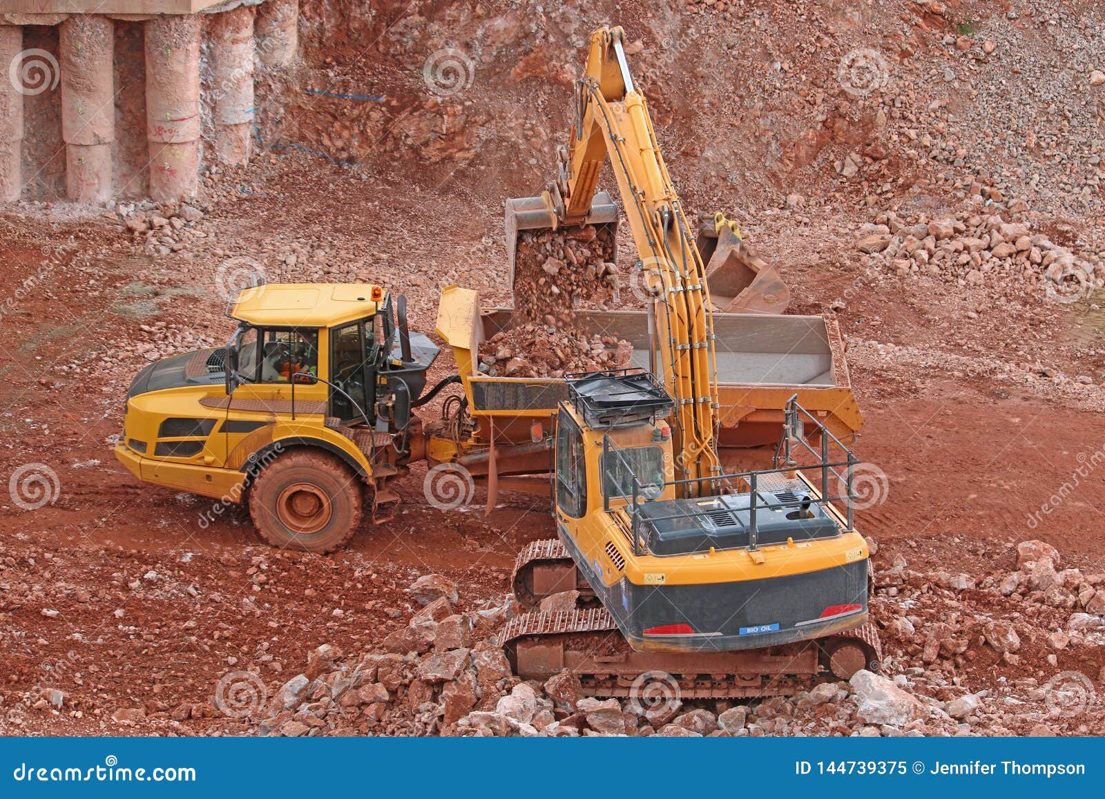 Digger Loading Trucks With Soil Stock Photo | CartoonDealer.com #39159336