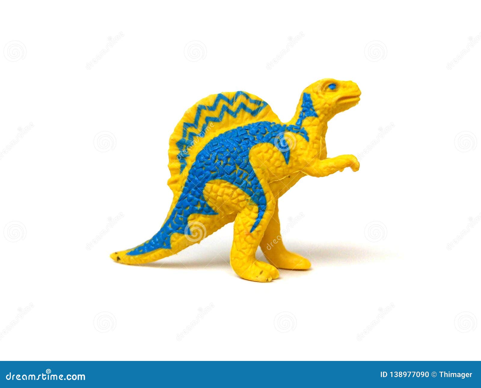 Yellow dinosaur toy. stock photo. Image of closeup, ecology - 138977090
