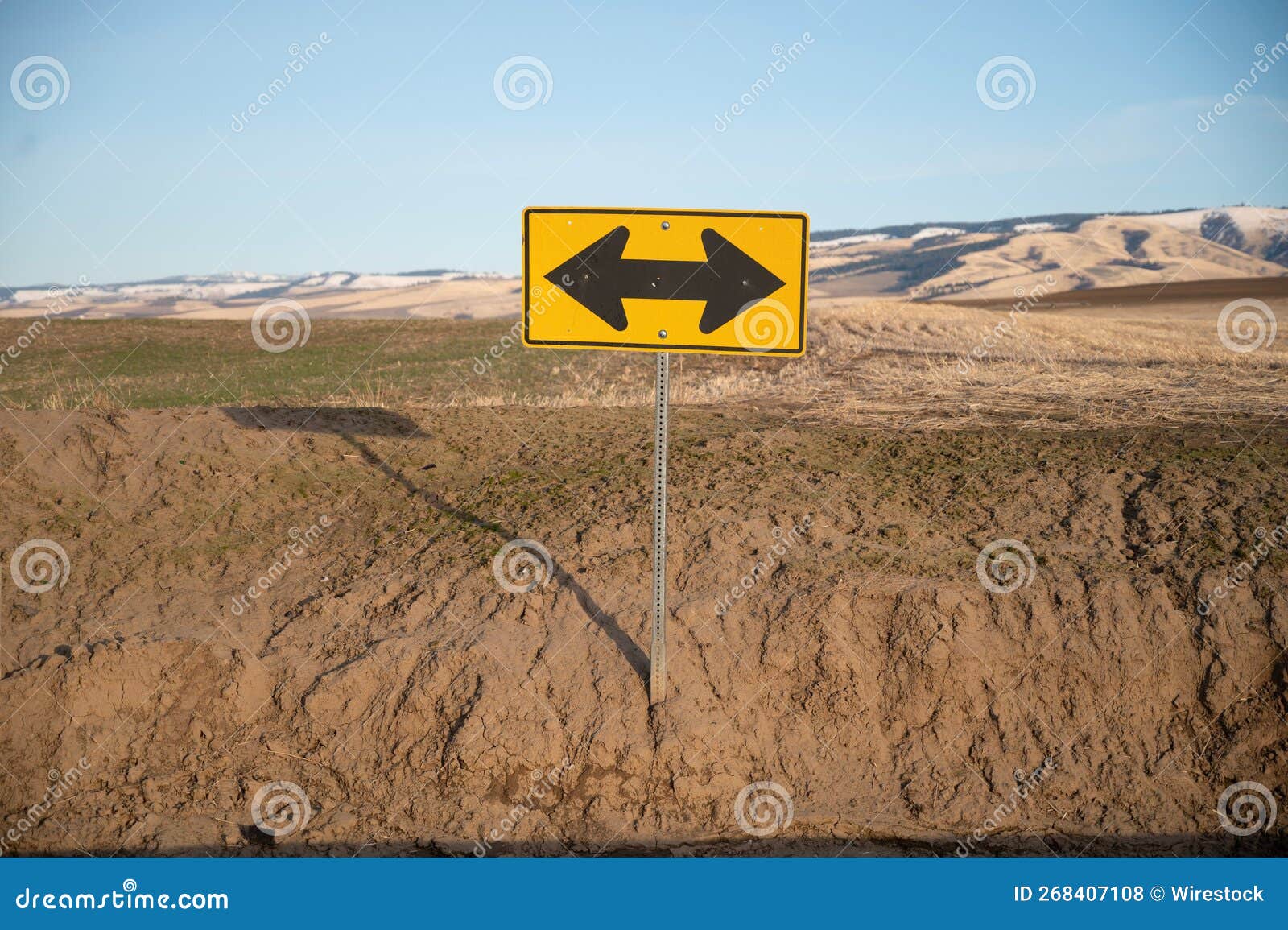Yellow Double Arrow Sign in the Desert Stock Photo - Image of direction ...