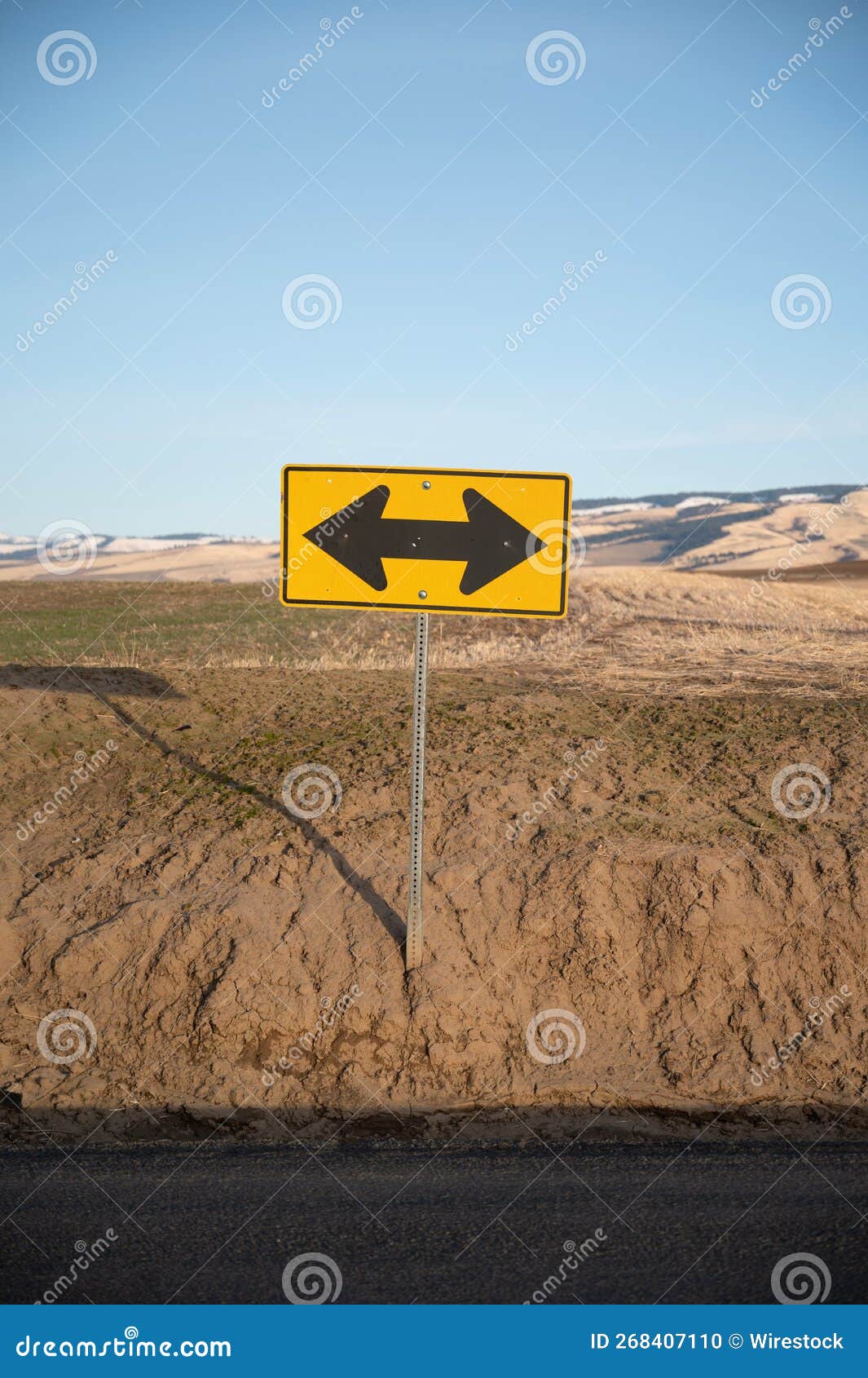 Yellow Double Arrow Sign in the Desert Stock Photo - Image of double ...