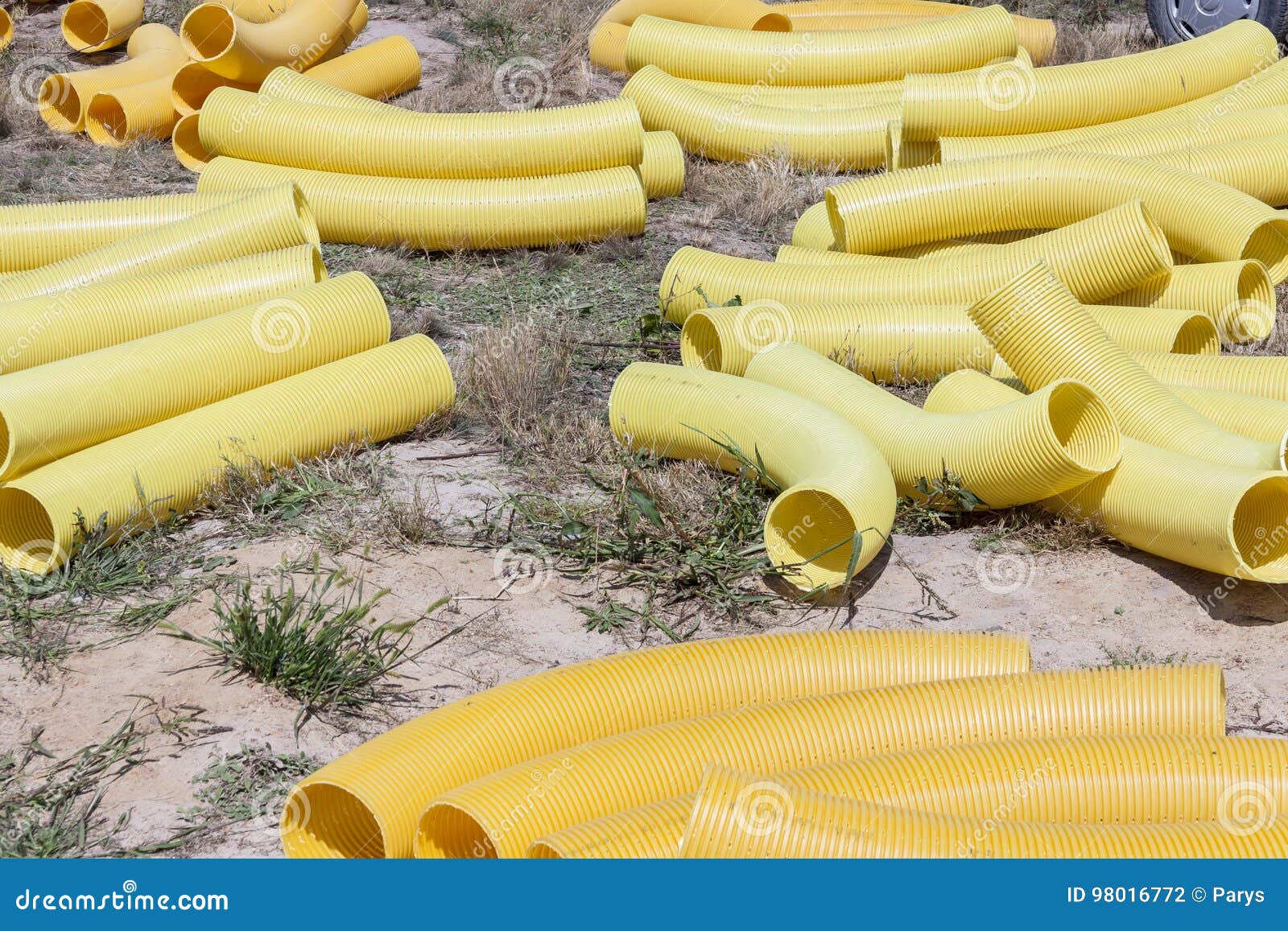 Yellow drain pipe stock photo. Image of green, industry - 98016772