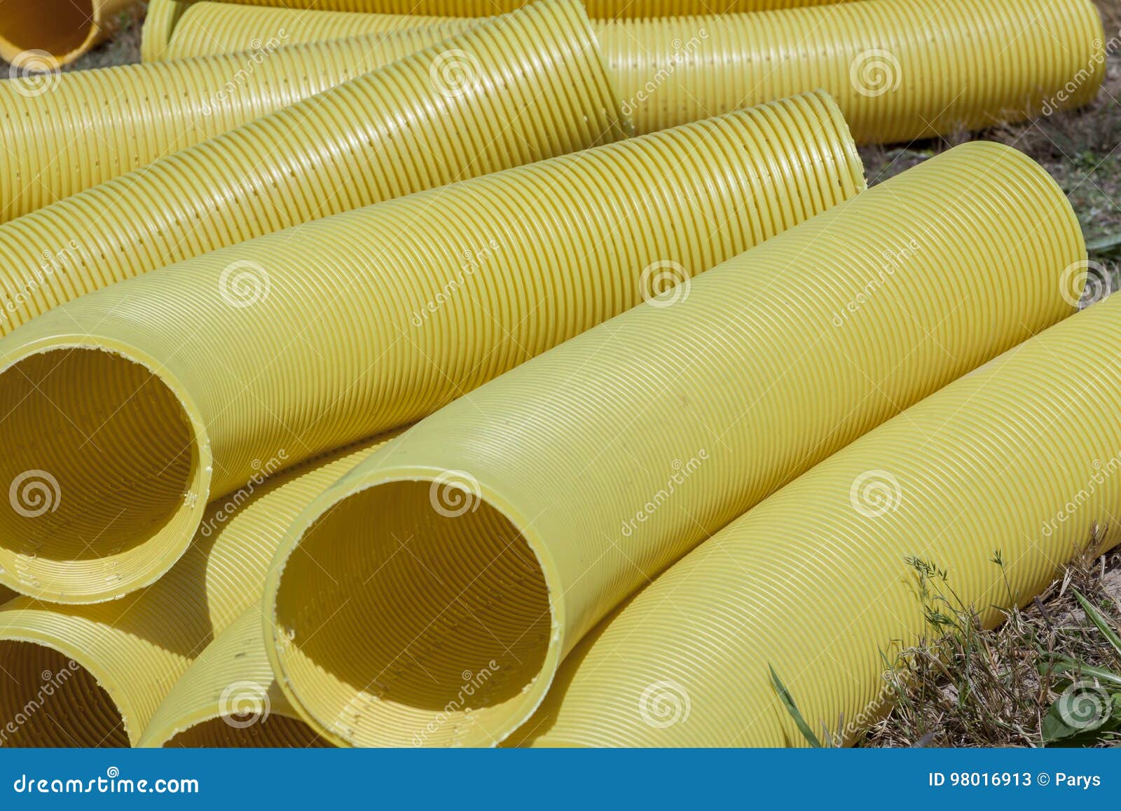 Yellow drain pipe stock image. Image of grass, construction - 98016913