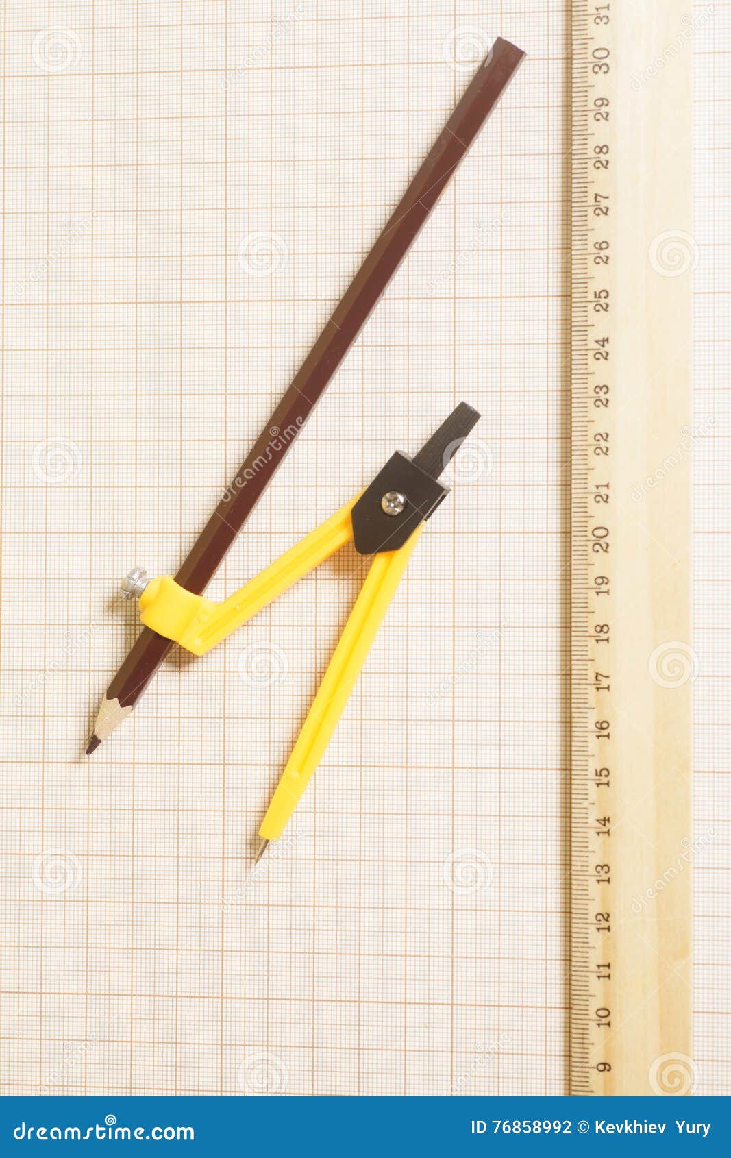 Yellow Drawing Compass with Black Pencil and Ruler on Graph Stock Photo ...