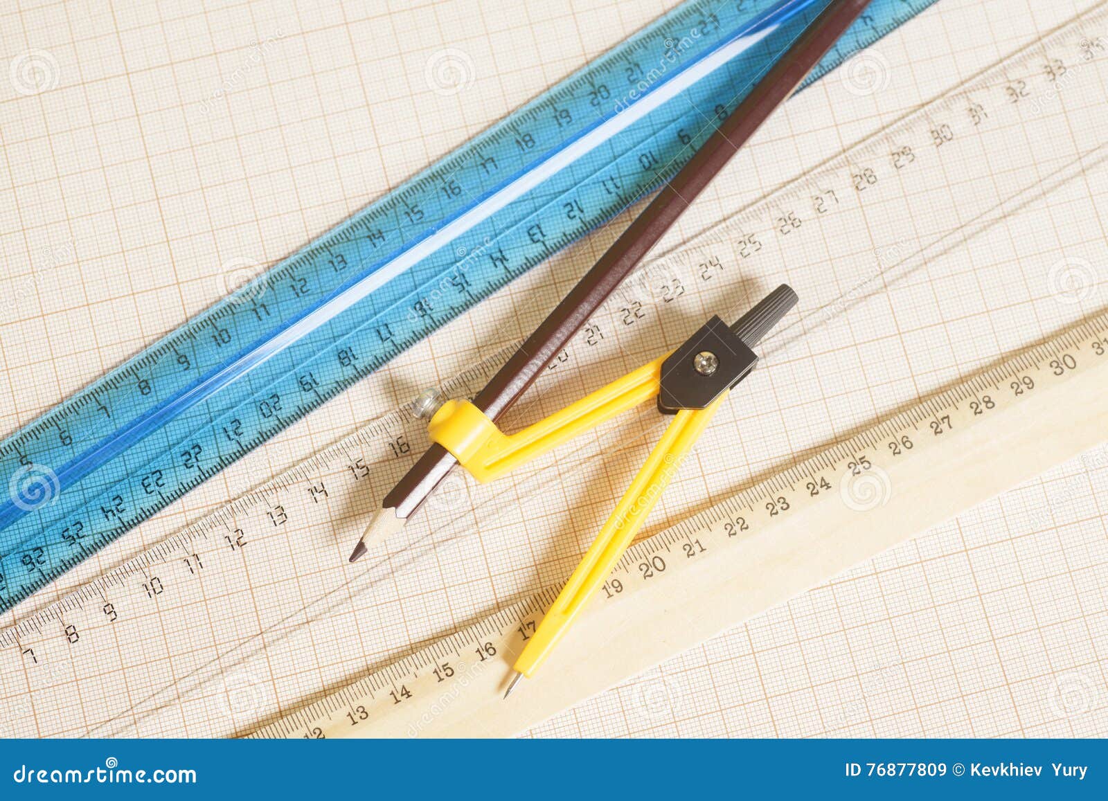 Yellow Drawing Compass with Black Pencil and Rulers on Graph Pap Stock ...