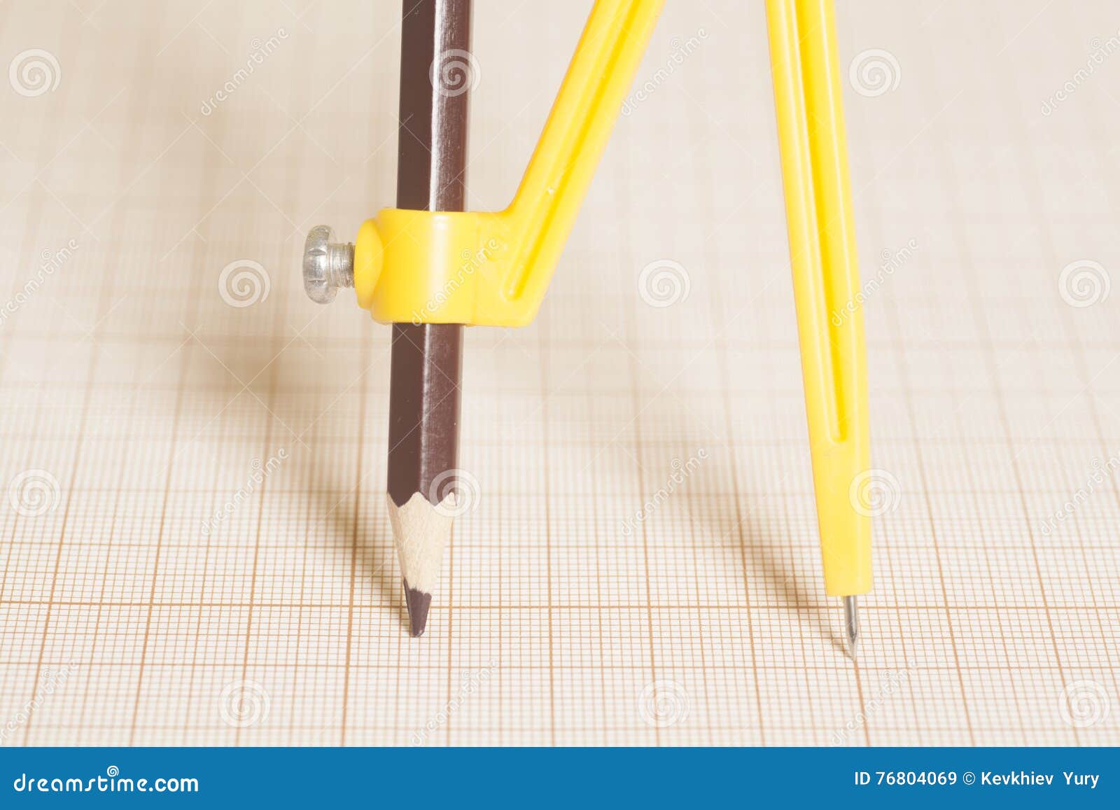 Yellow Drawing Compass on Graph Paper Stock Image - Image of graph ...