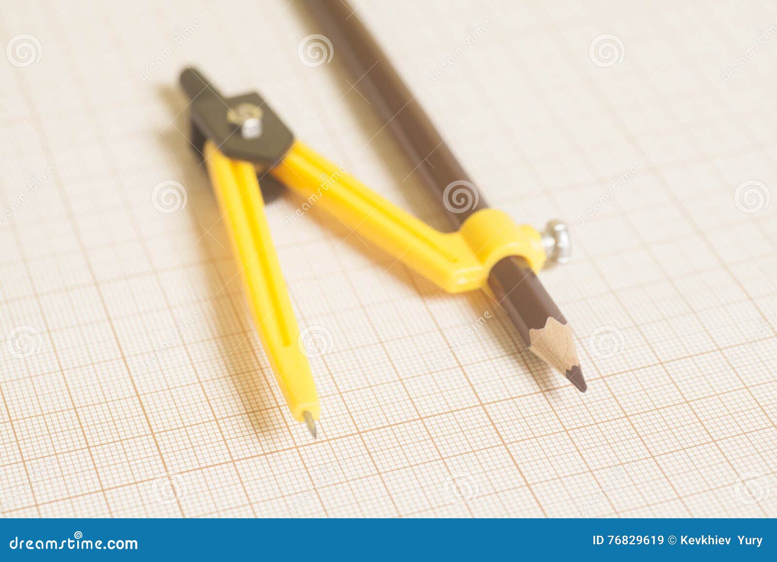 Yellow Drawing Compass on Graph Paper Stock Image - Image of ideas ...
