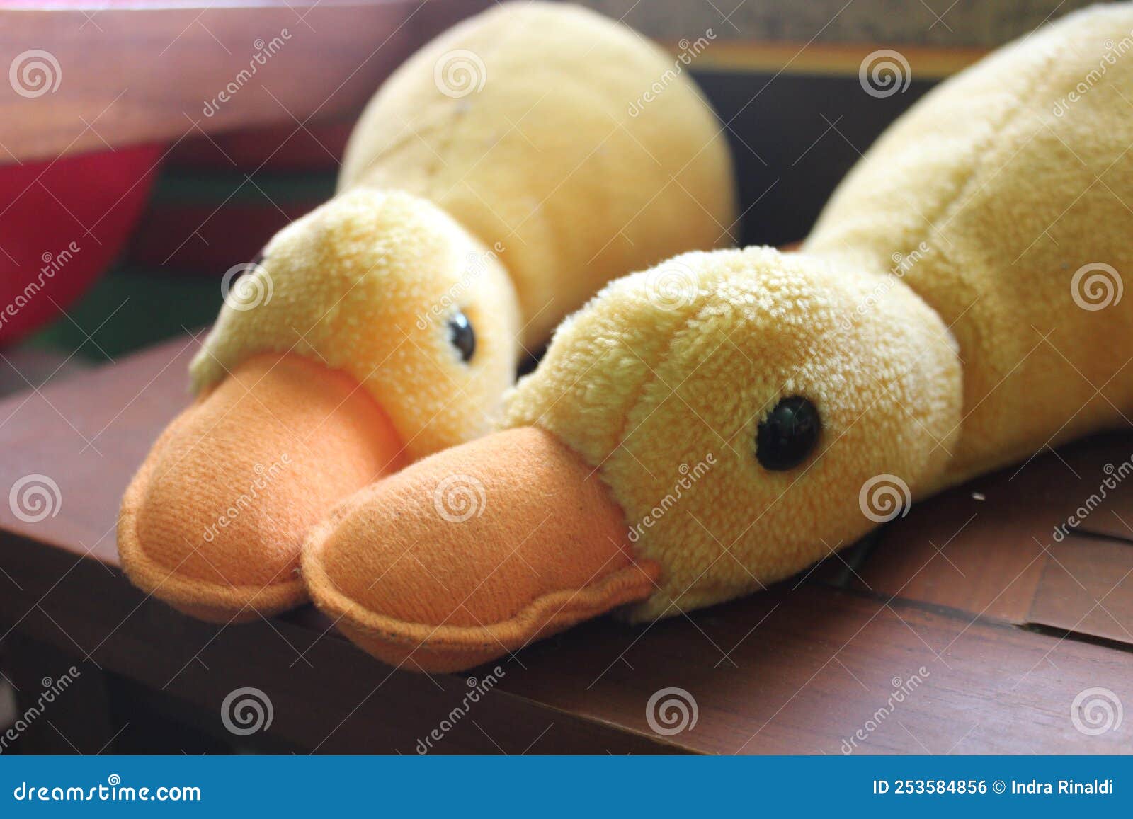 Yellow Ducks, Stuffed Animals, Getting Along on a Wooden Table Stock ...