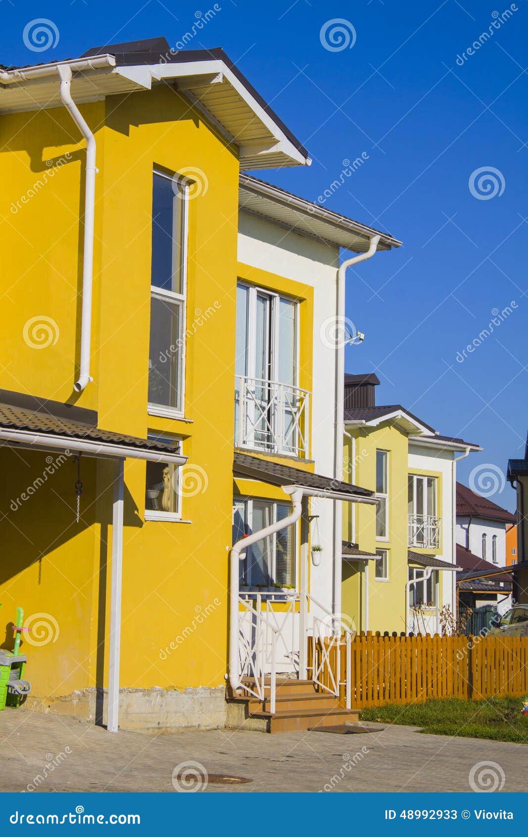 Yellow Duplex house stock image. Image of garden, chair - 48992933