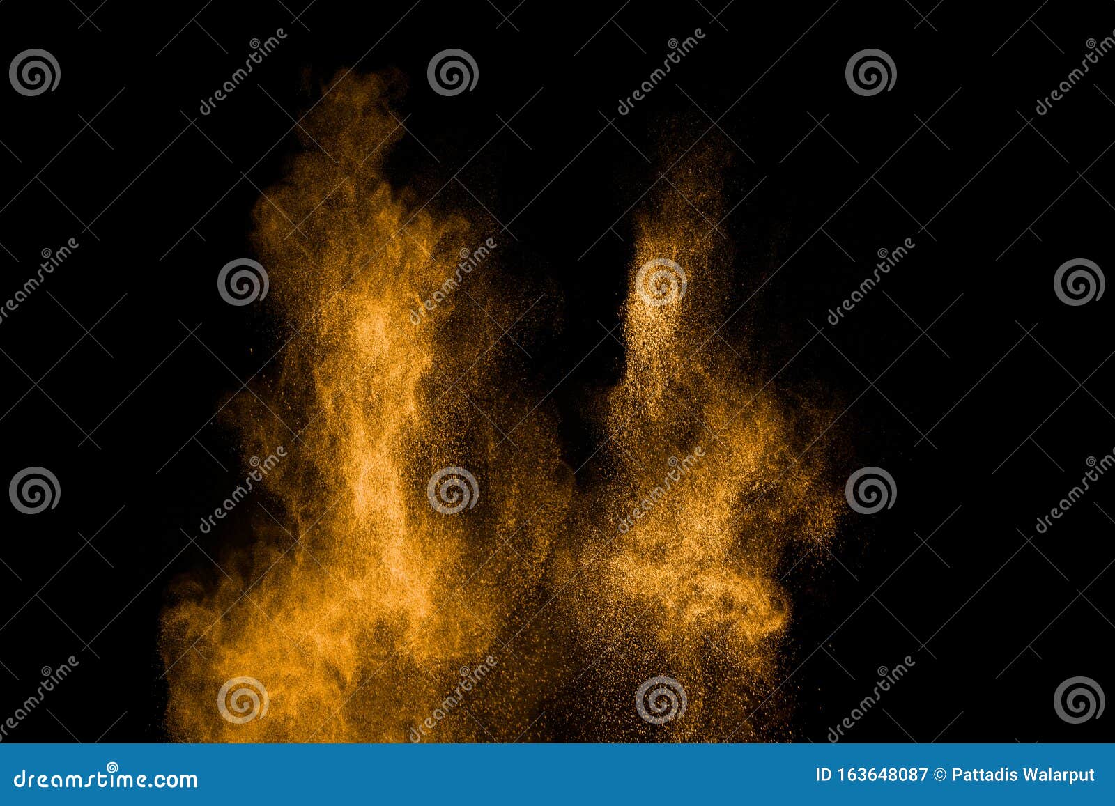 Yellow Dust Particles Explosion on Black Background.Yellow Powder ...