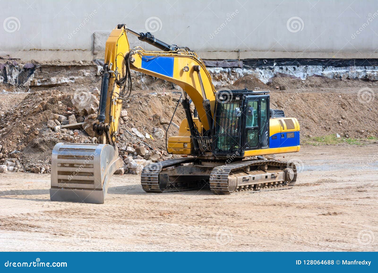 Yellow Earth Mover at a Construction Site Stock Photo - Image of ...