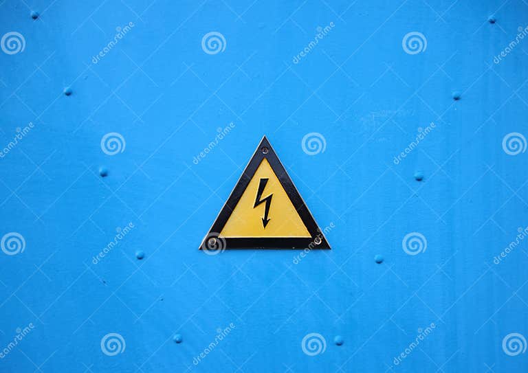 Yellow Electrical Warning Triangle Sign on Blue Background Stock Image ...