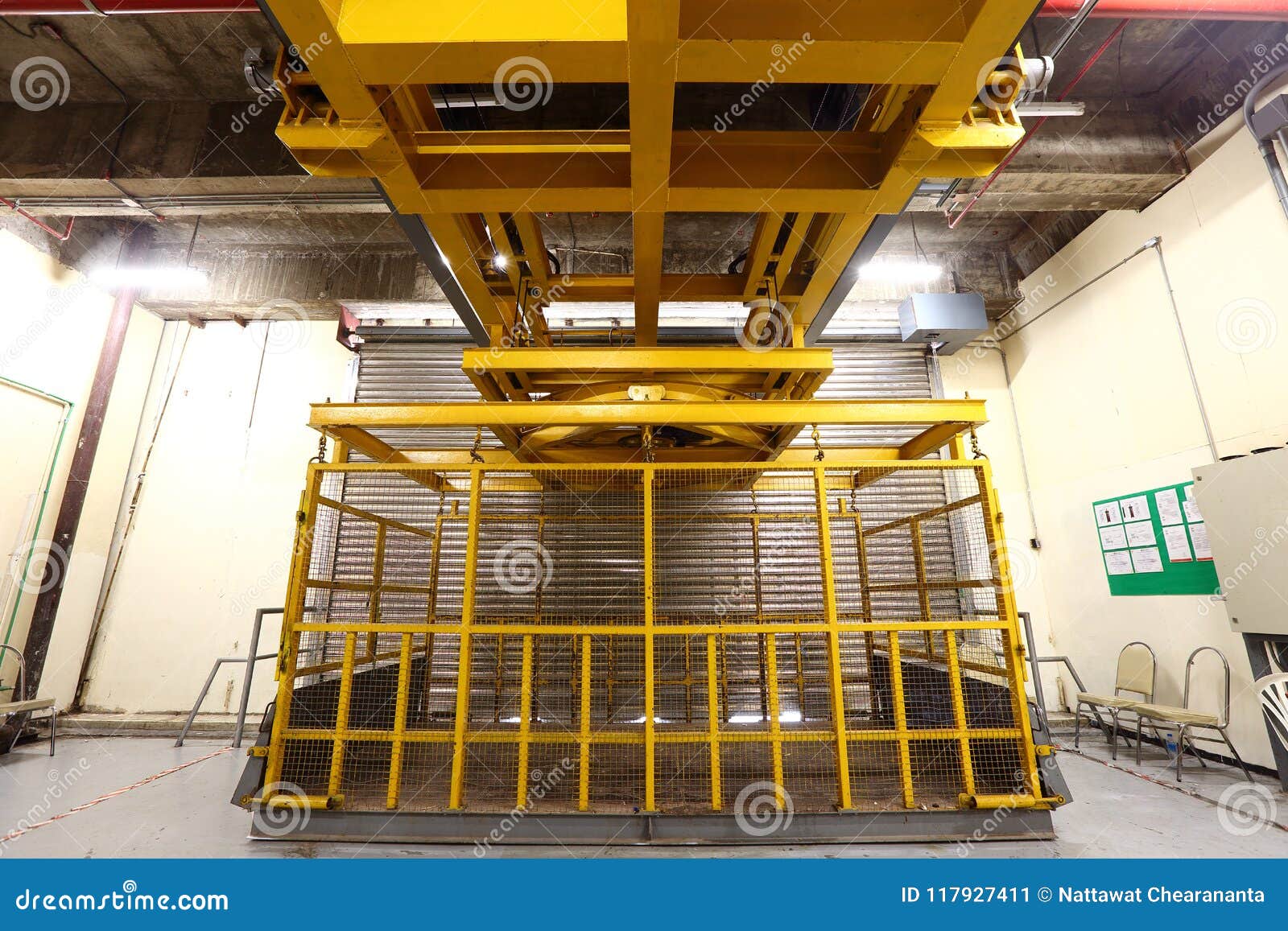 Yellow Elevator in Loading Bay To Load Heavy Machine Inside Building ...