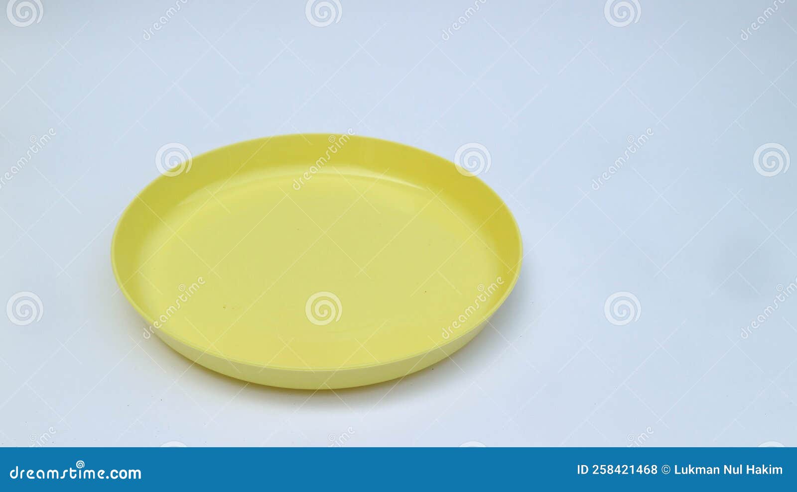 Yellow Empty Plastic Plates Isolated on White Background Stock Photo ...
