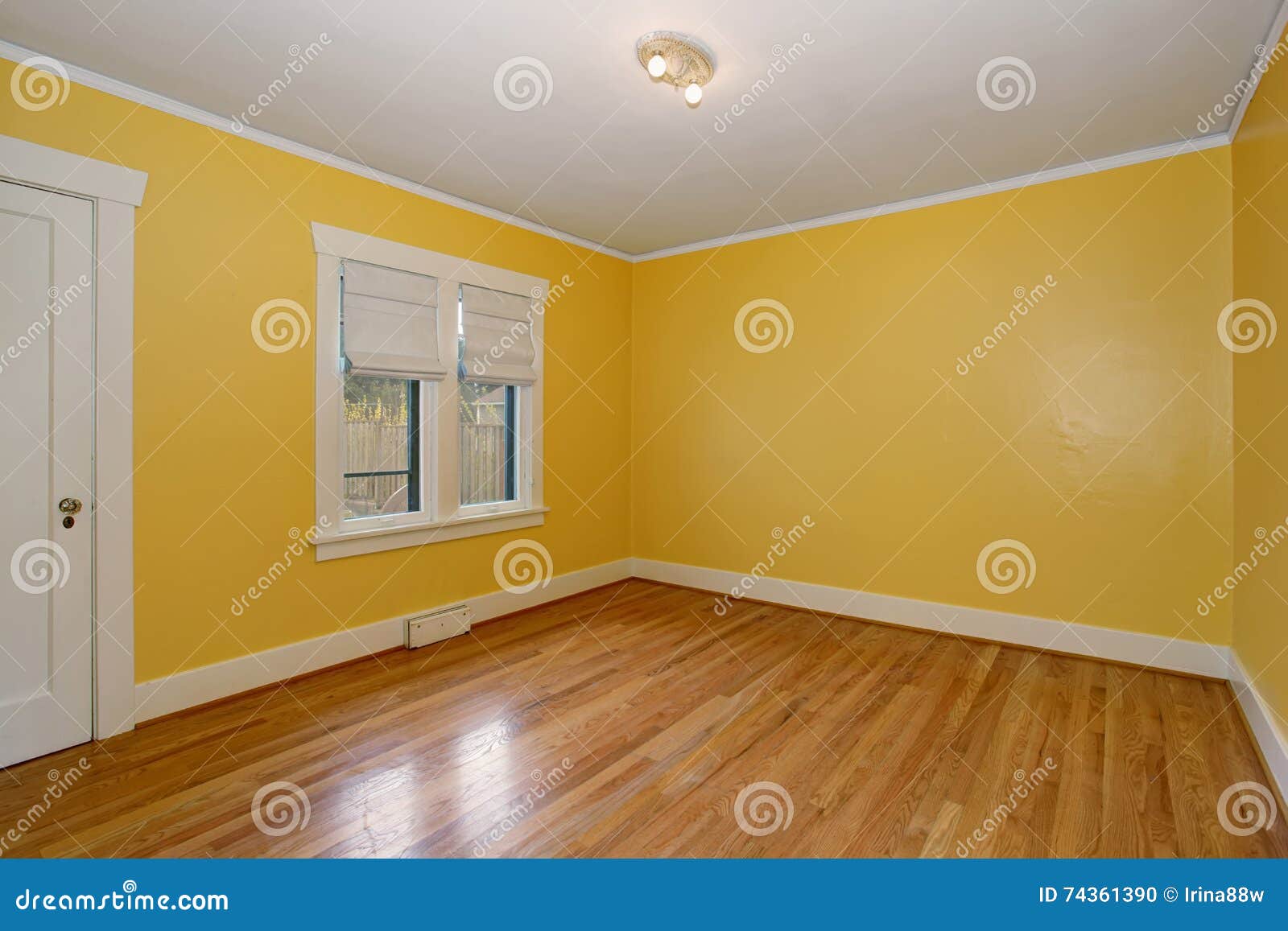 Yellow Empty Room with Hardwood Floor and Double Window Stock Photo ...