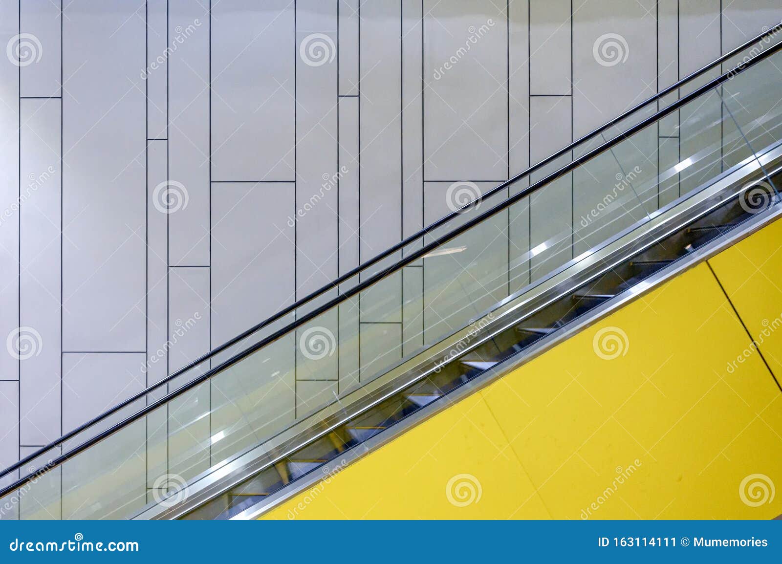 Beside Yellow Escalator with Lighting on Wall Stock Image - Image of ...