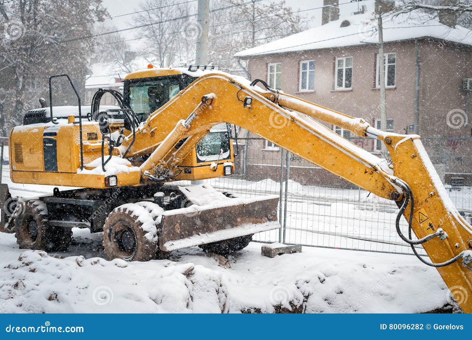 Yellow Excavator Covered by Snow at Winter Construction Site Stock ...