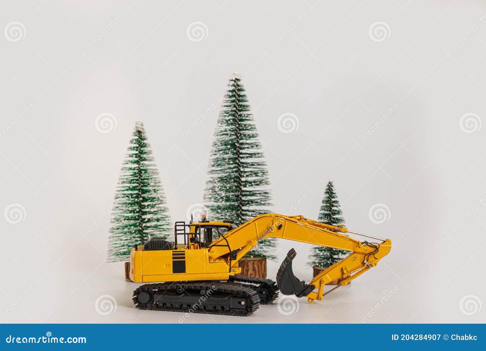 Yellow Excavator Model and Christmas Tree . Stock Image - Image of ...