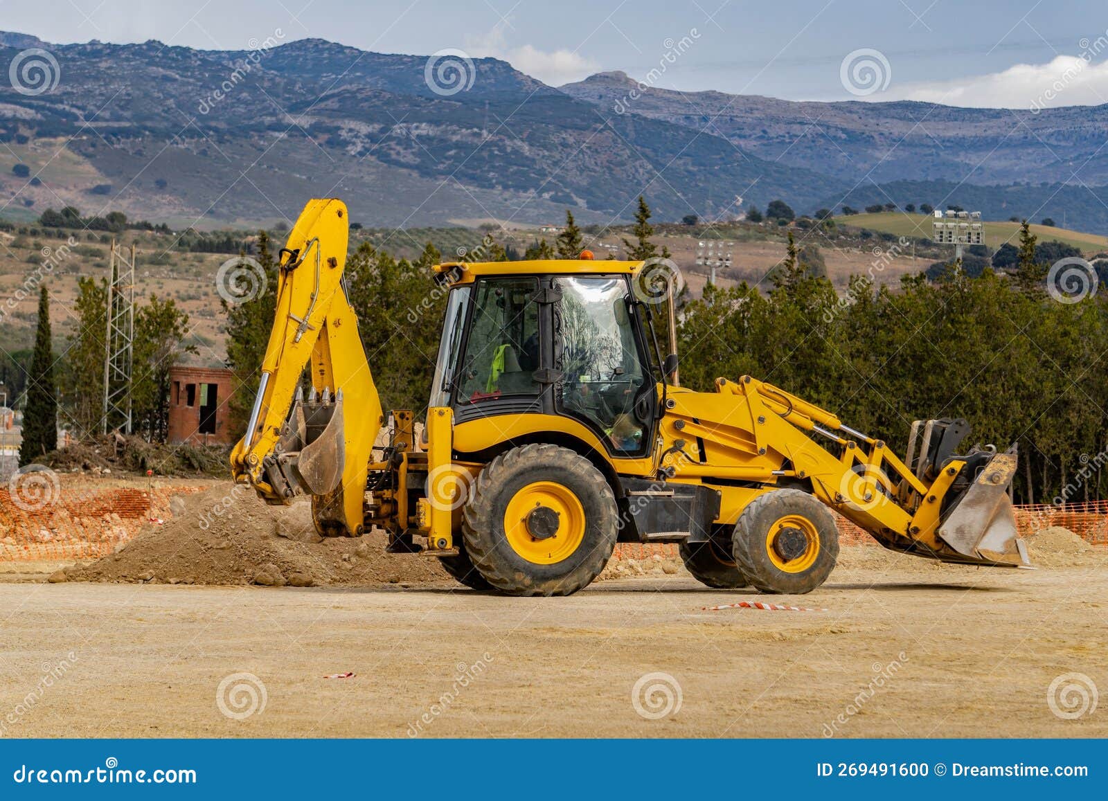Yellow excavator at work stock photo. Image of site - 269491600