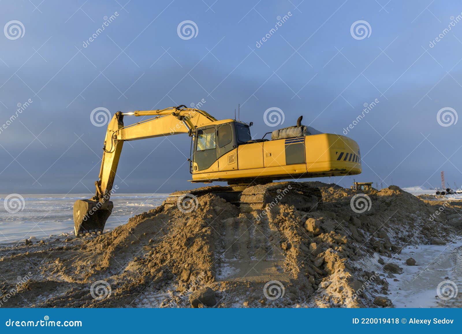 Yellow Excavator Working on Construction Site. the Road Construction ...