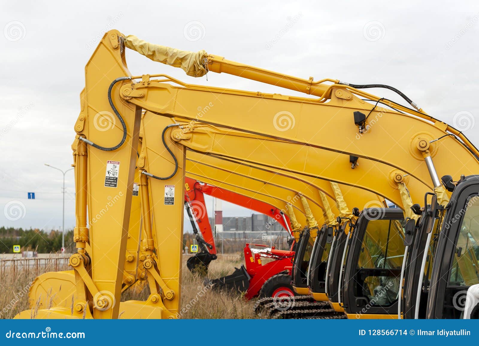 Yellow Excavators are Located in One Row. Stock Photo - Image of ...