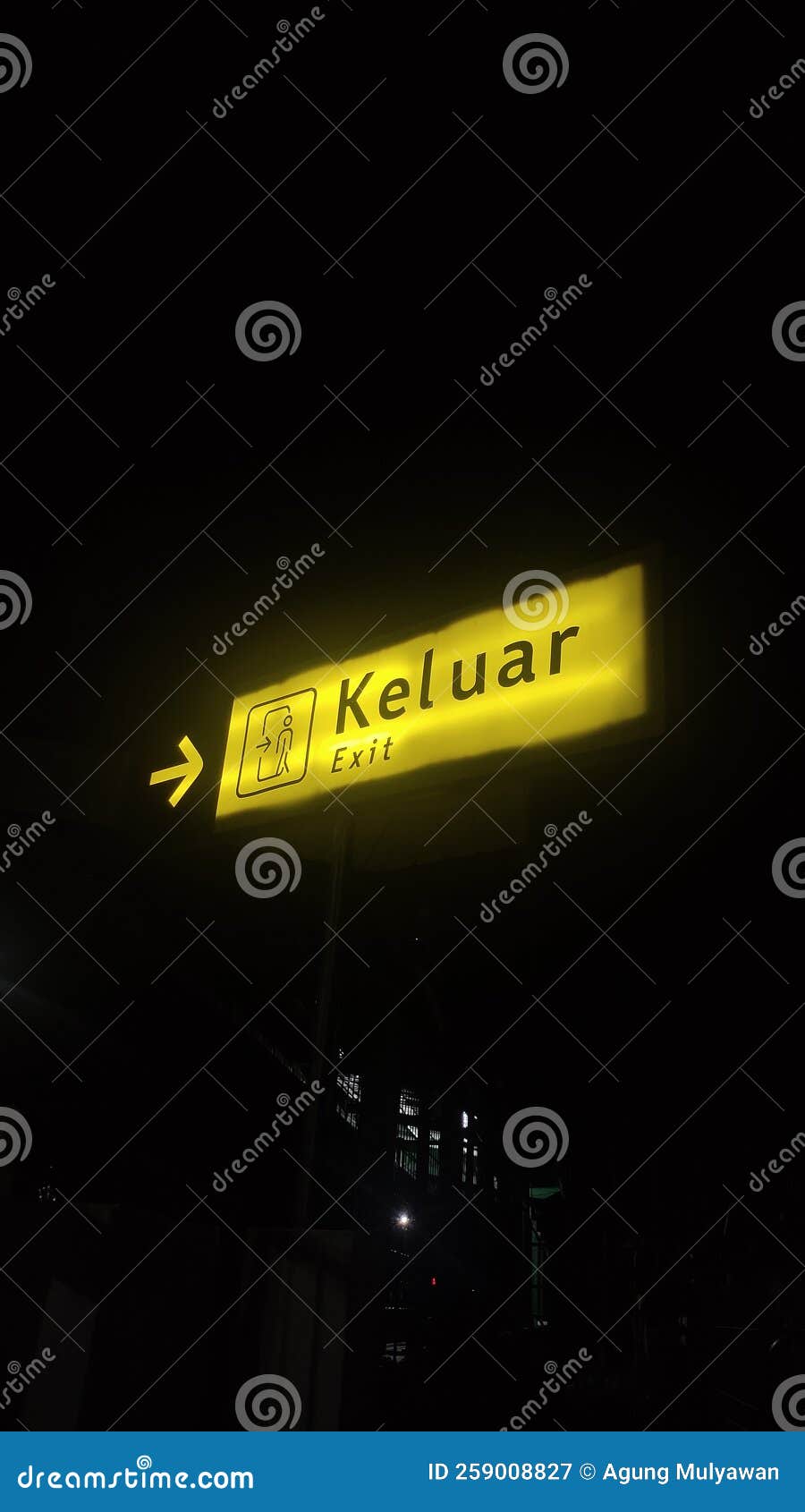 Yellow Exit Sign at Night at the Train Station, Central Java, Indonesia ...