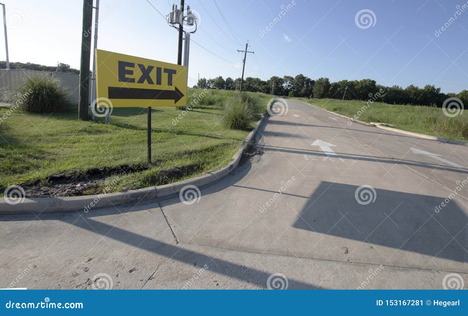 Yellow Exit Sign Outdoors Pointing Towards an Empty Roadway Stock Image ...