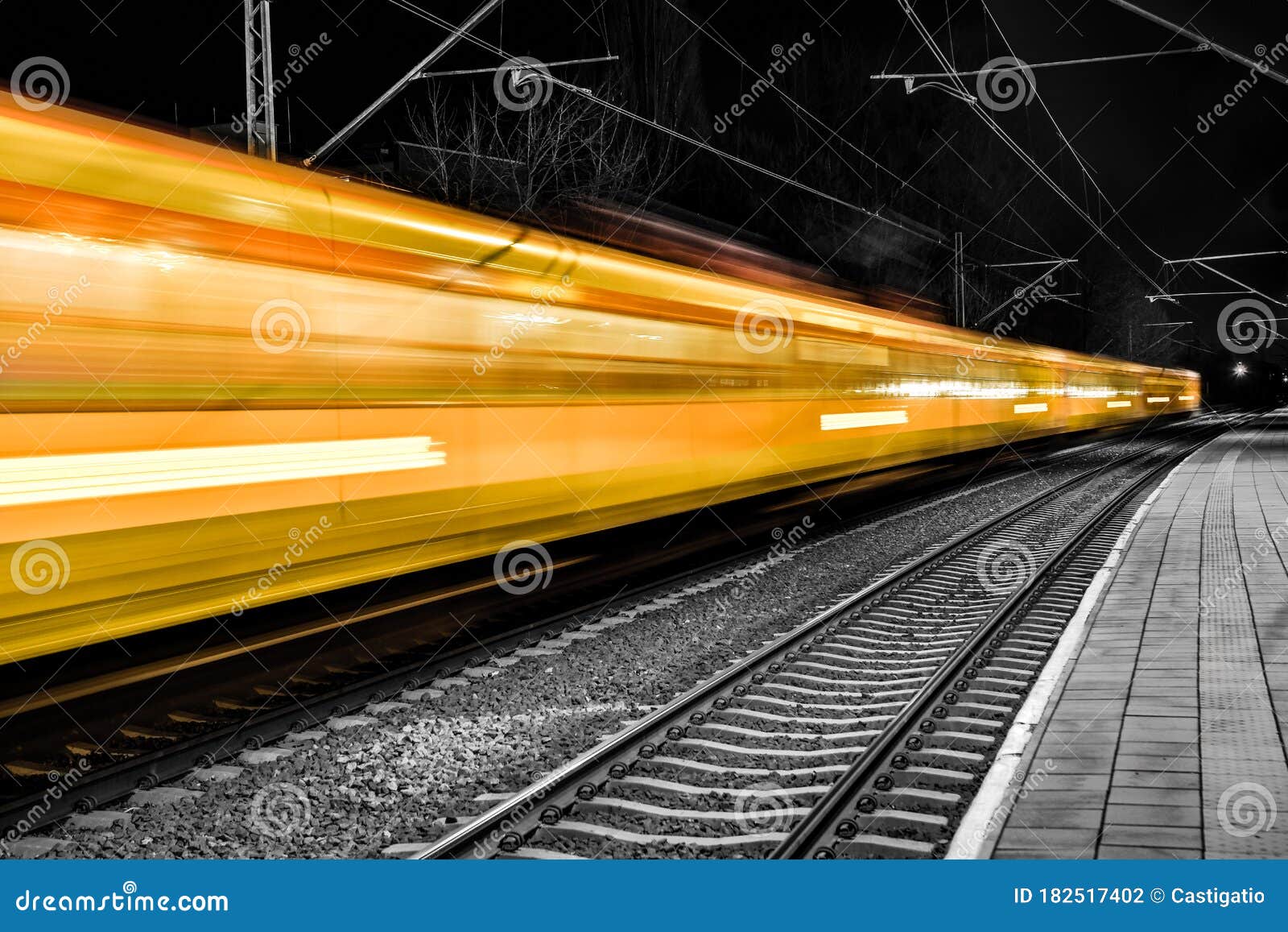A Yellow Express Train Passing through the Railway Station Stock Photo ...