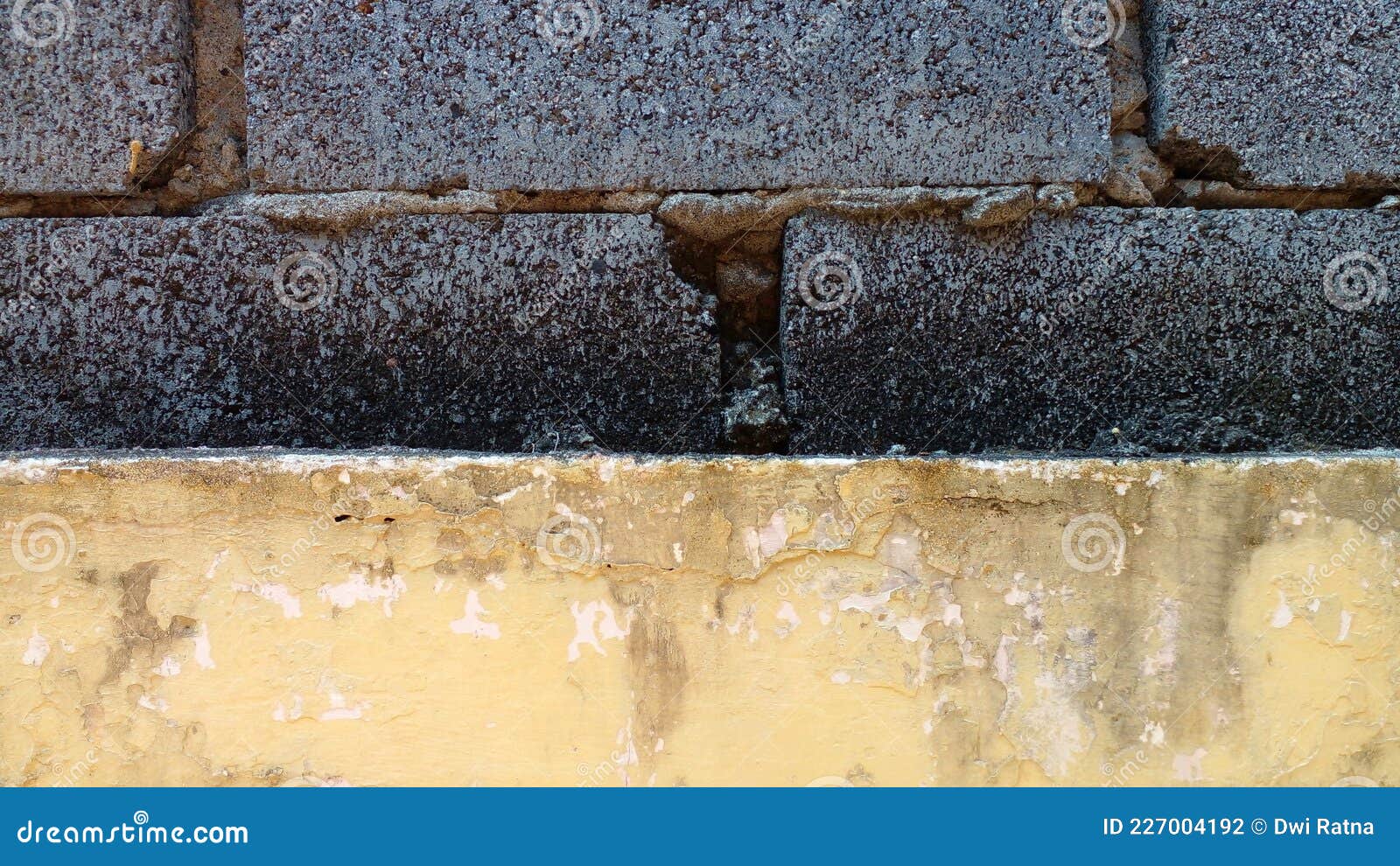 Yellow Faded Wall and Concrete Brick Wall As Background. Stock Photo ...